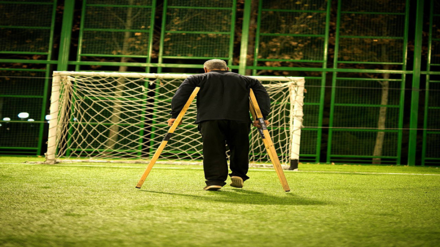 A man with two golden crutches